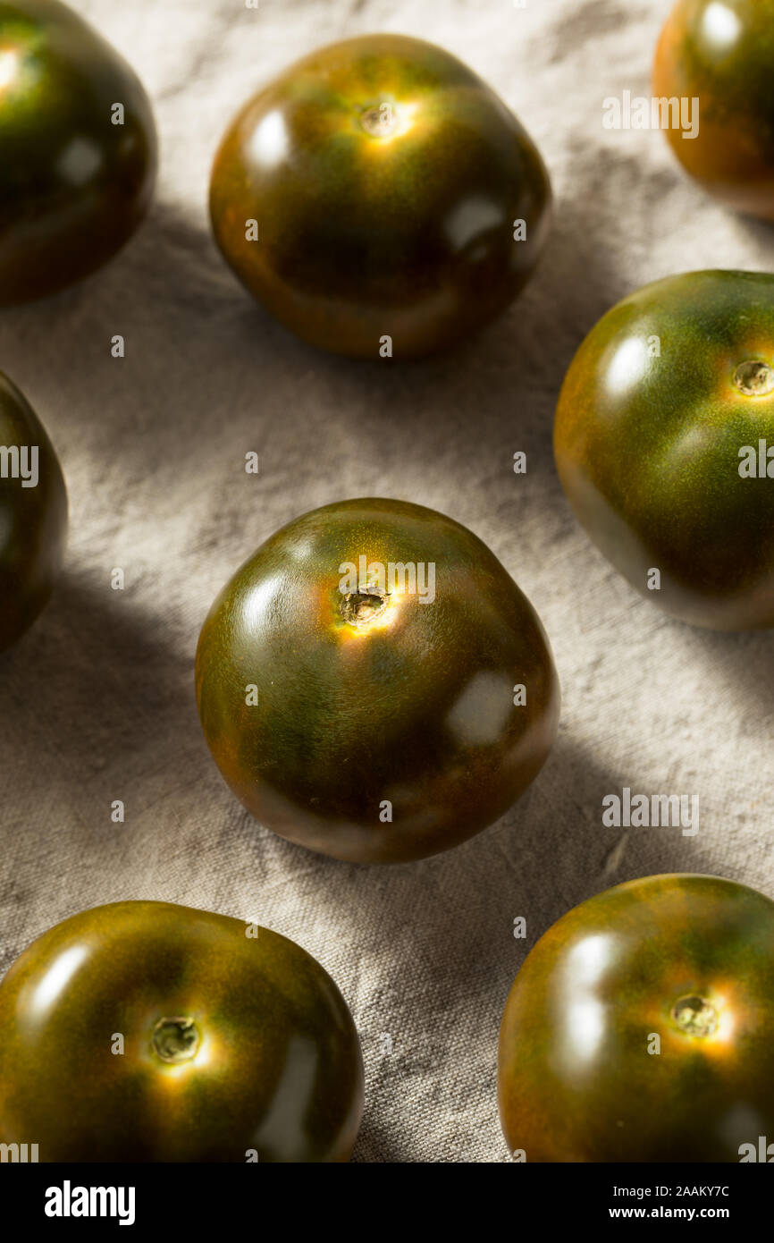 Raw Brown Organic Kumato Tomatoes Ready to Eat Stock Photo - Alamy