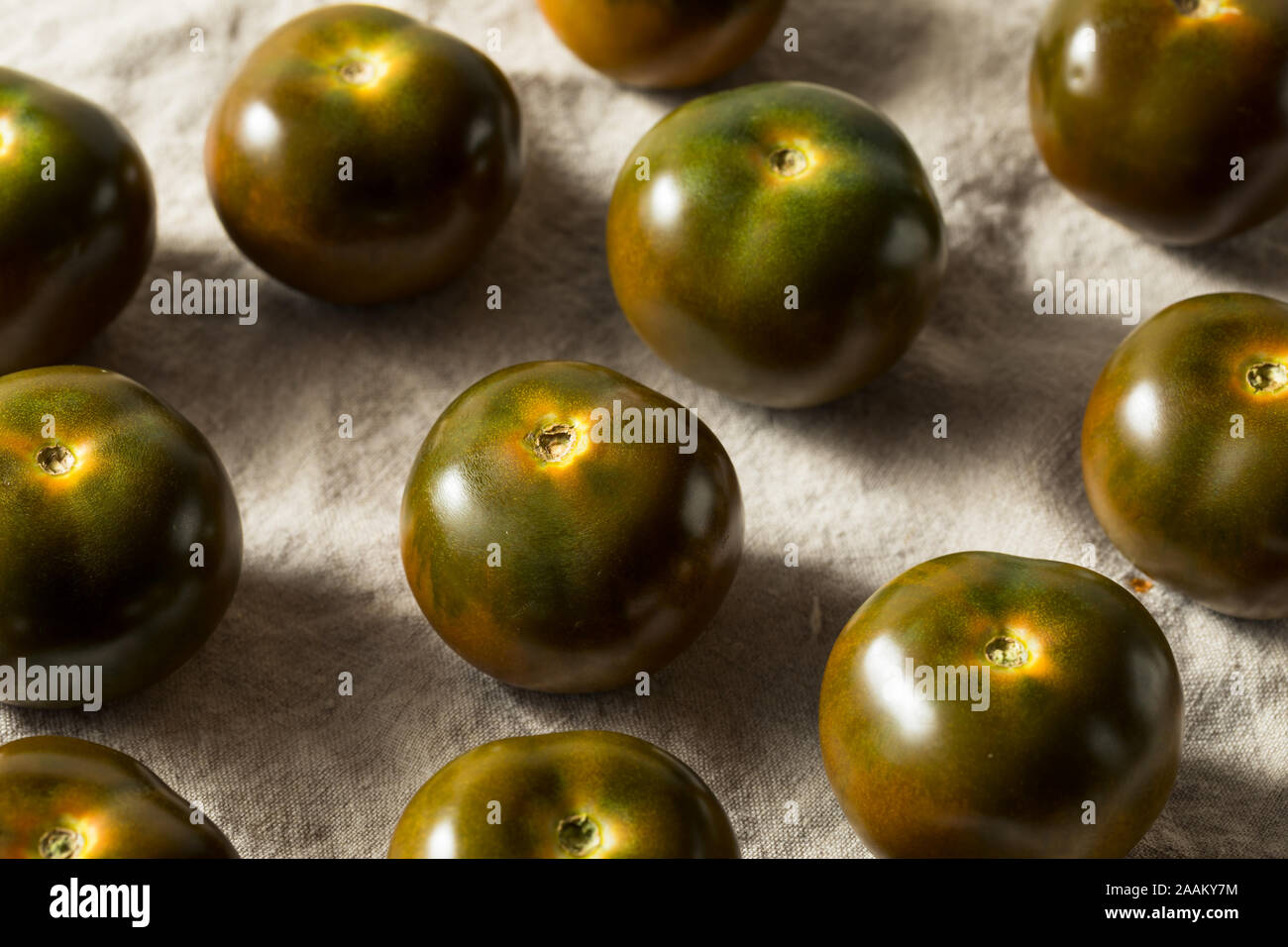 Raw Brown Organic Kumato Tomatoes Ready to Eat Stock Photo - Alamy