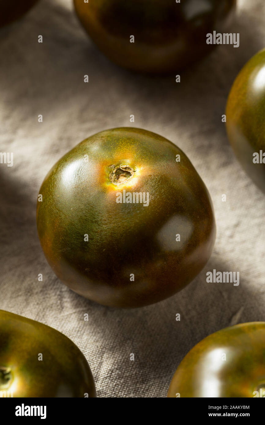 Raw Brown Organic Kumato Tomatoes Ready to Eat Stock Photo - Alamy