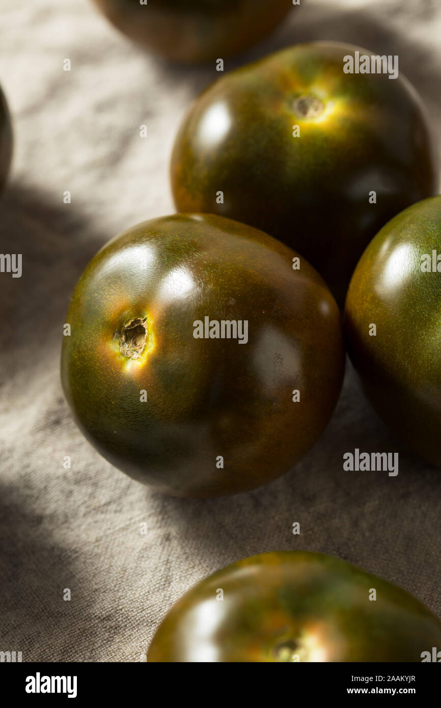 Raw Brown Organic Kumato Tomatoes Ready to Eat Stock Photo - Alamy