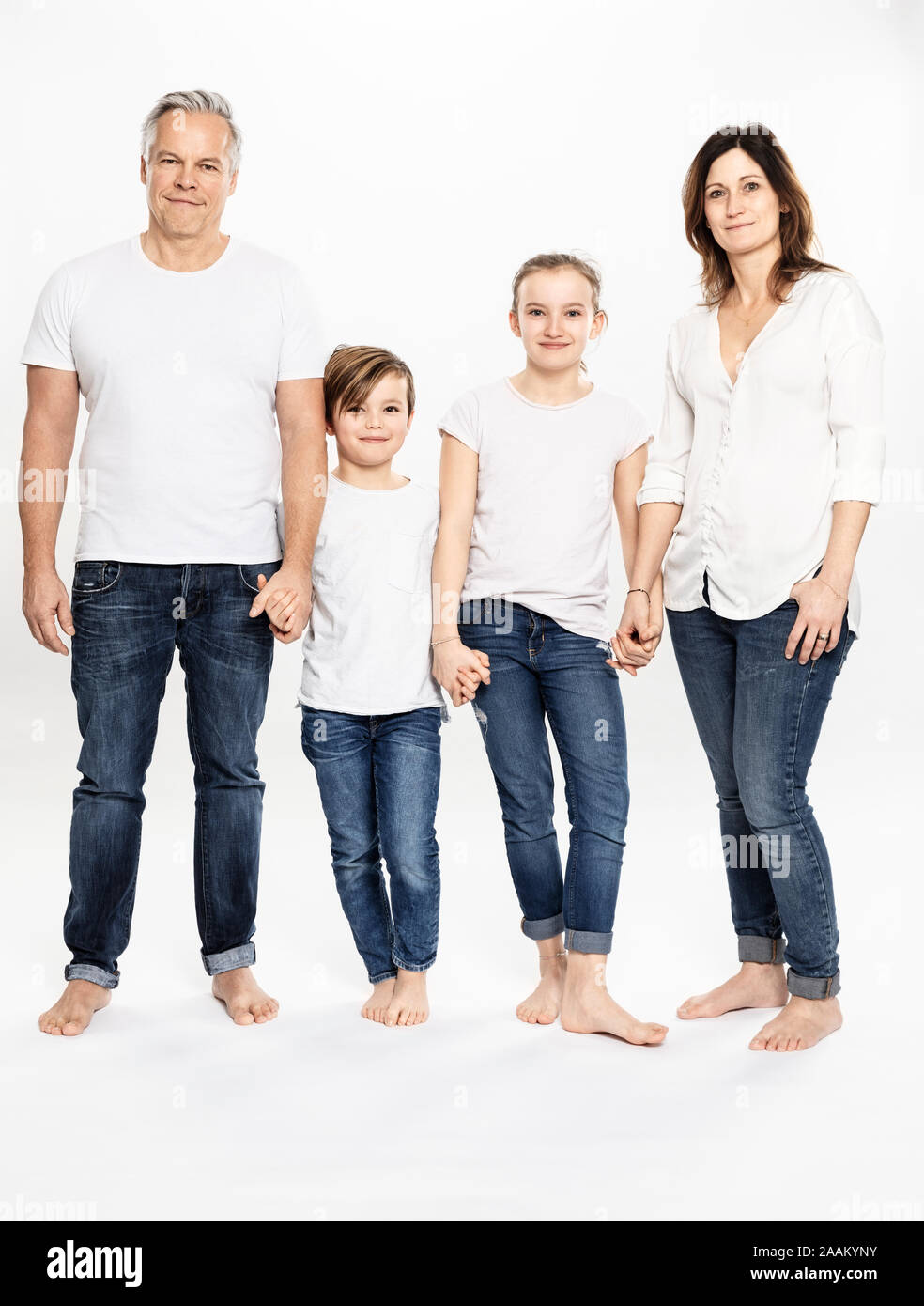 Family of four, white background Stock Photo - Alamy