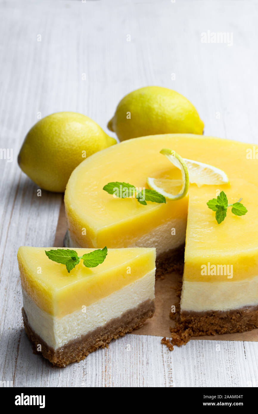 Homemade Layered Lemon Cheesecake on white wooden table Stock Photo - Alamy