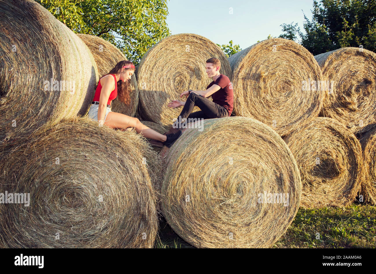 Man sitting on hay bale hi-res stock photography and images - Alamy