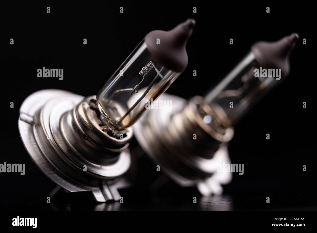 Blown car bulbs on a dark table. Spare parts for passenger cars. Black ...