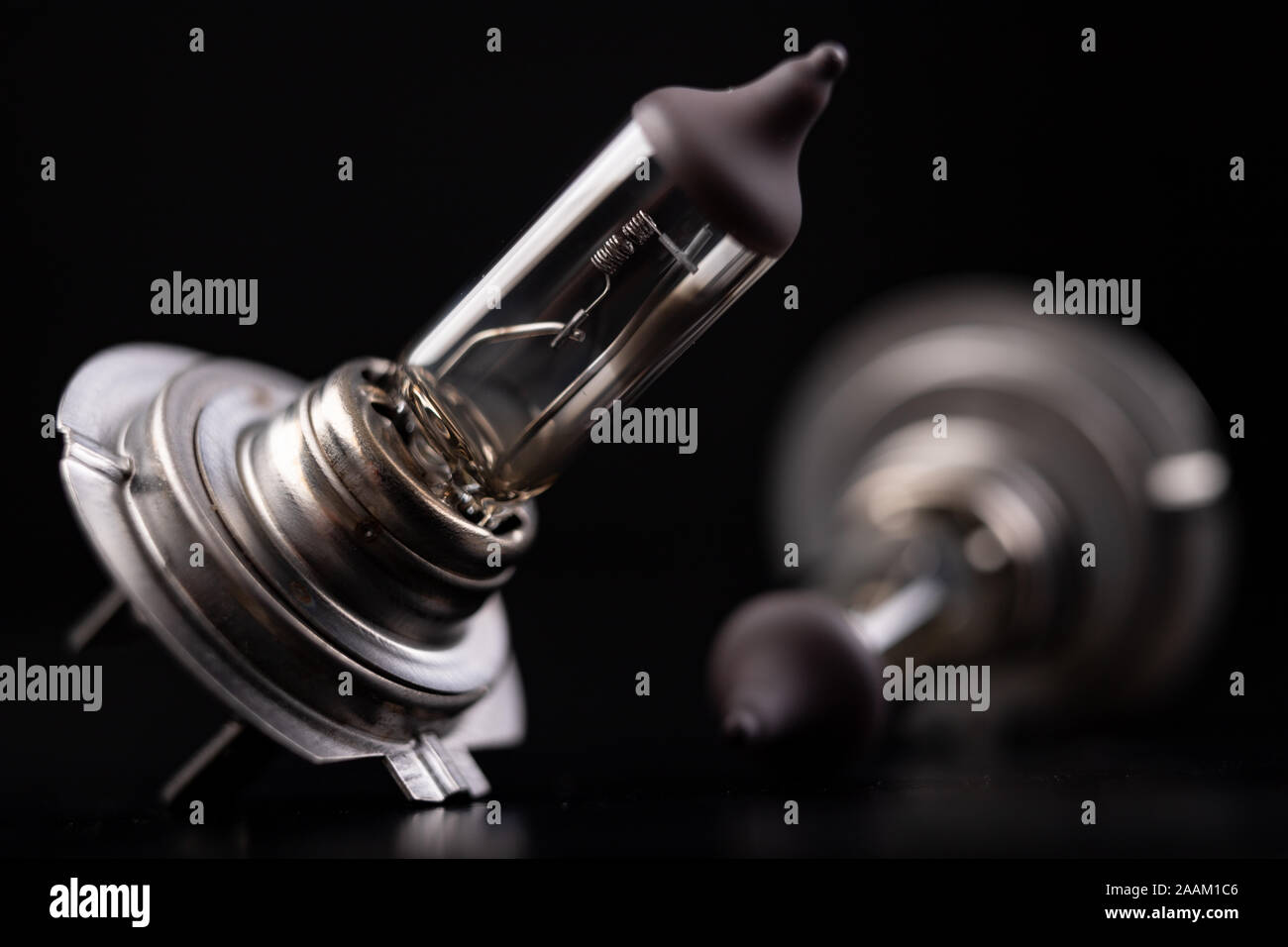 Blown car bulbs on a dark table. Spare parts for passenger cars. Black ...