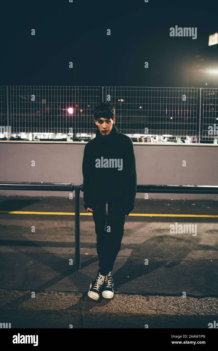 Man leaning against railing hi-res stock photography and images - Alamy