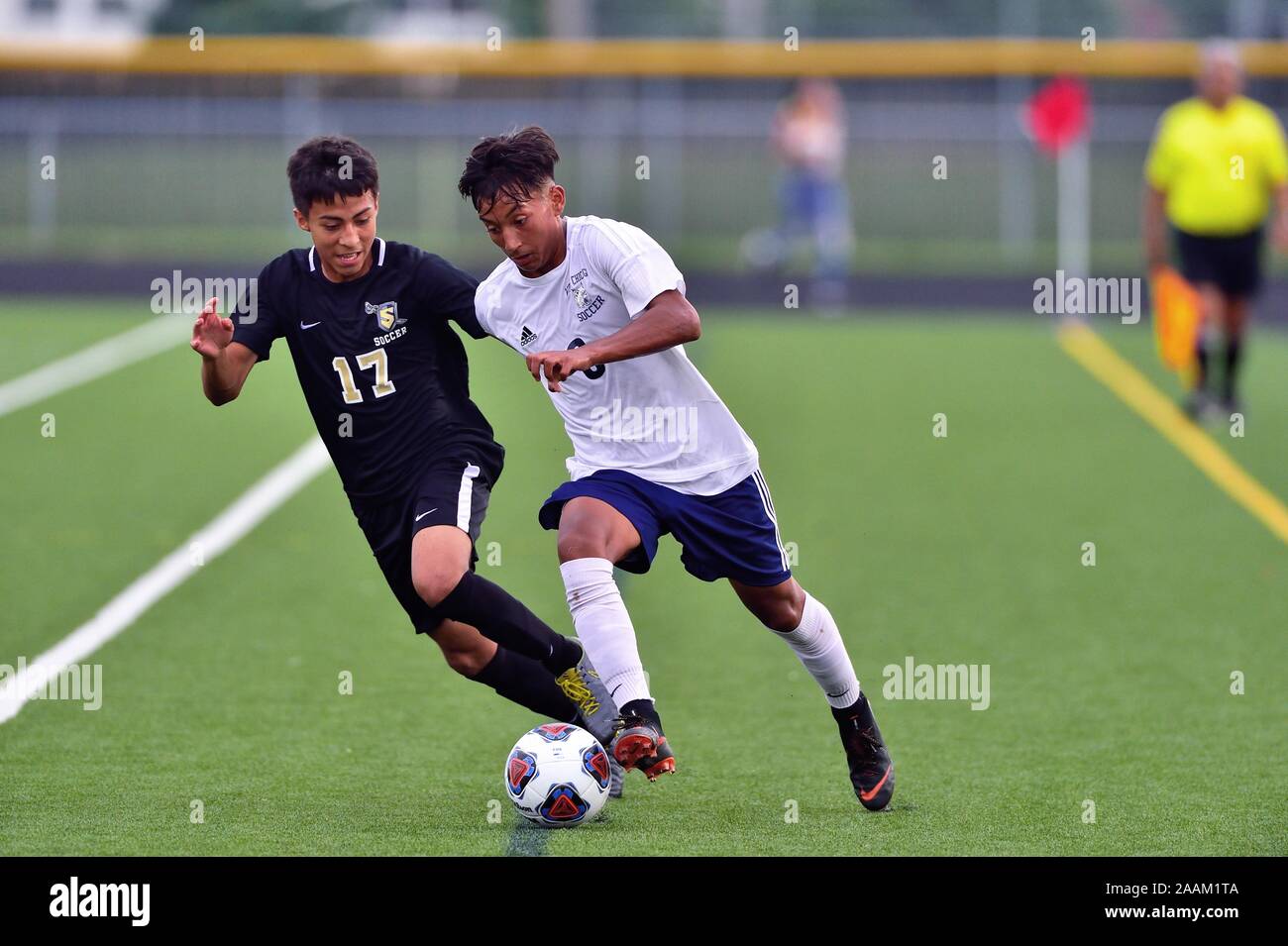 Forward leading a rush while pursued by an opposing defender Stock ...