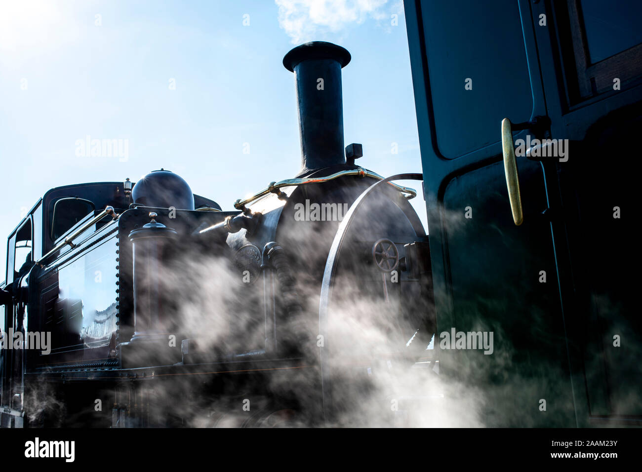 Steam train emitting clouds of smoke and steam Stock Photo - Alamy