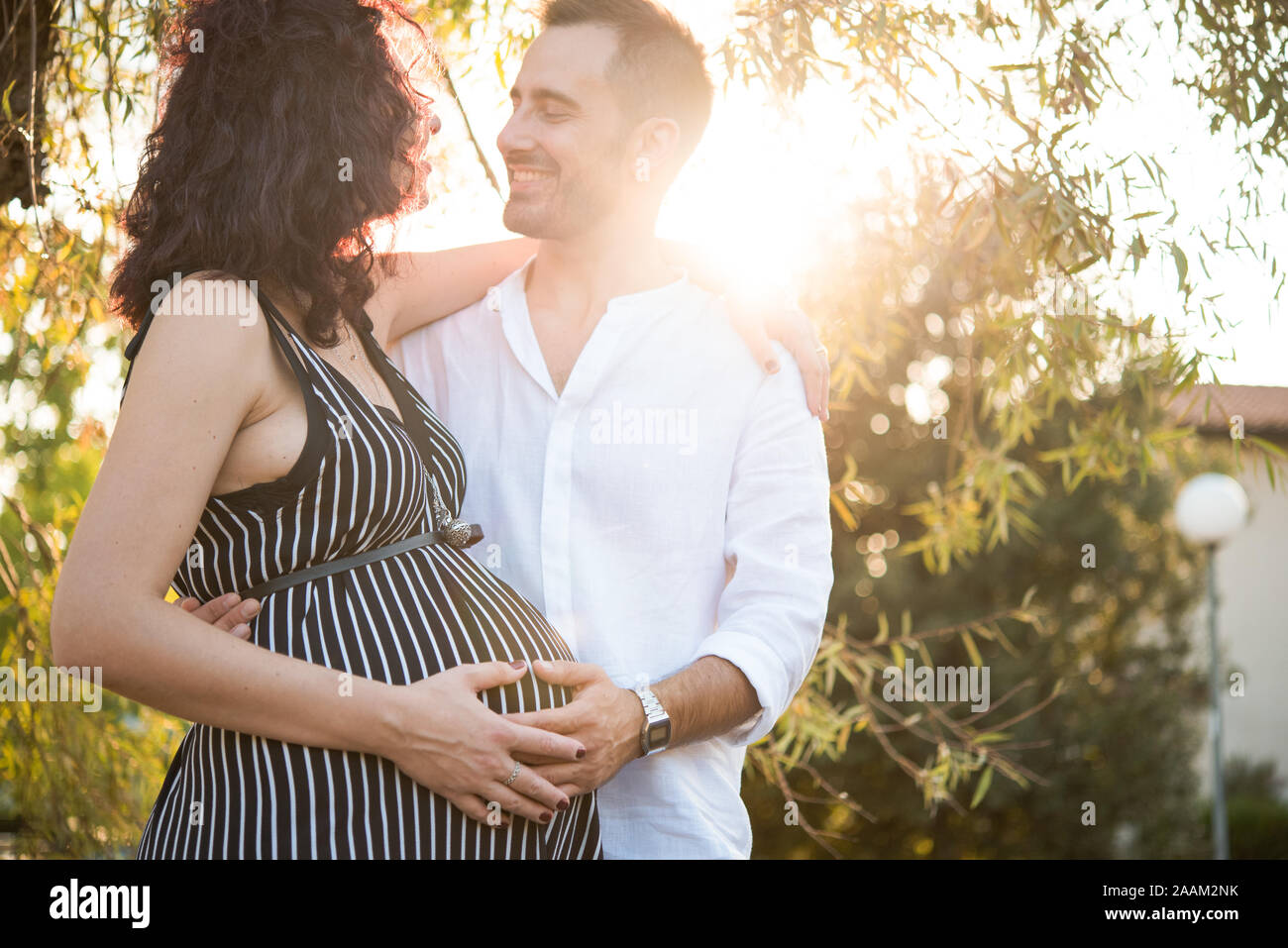 Man touching wife stomach hi-res stock photography and images - Alamy