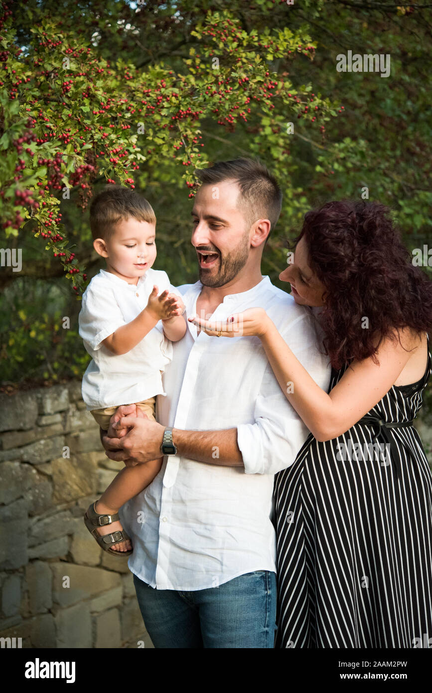 Parents with son in park Stock Photo - Alamy