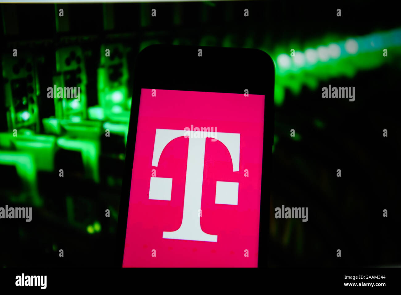 In this photo illustration a T Mobile logo seen displayed on a ...