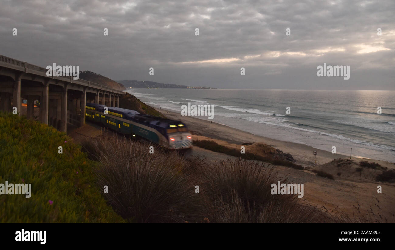 Coaster passenger diesel locomotive traveling along coastal railroad ...