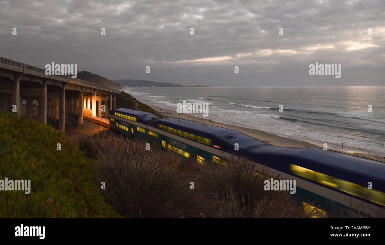 Coaster passenger diesel locomotive traveling along coastal railroad ...