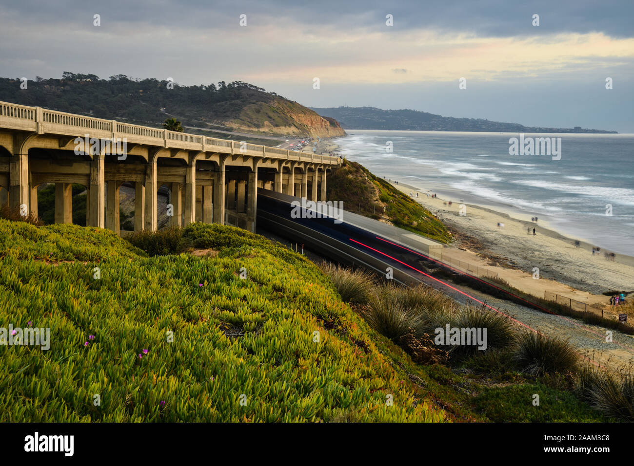 Amtrak passenger diesel locomotive traveling along coastal railroad ...