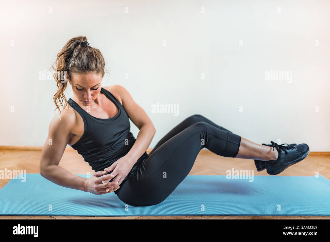 Woman abs crunches exercises workout hi-res stock photography and ...