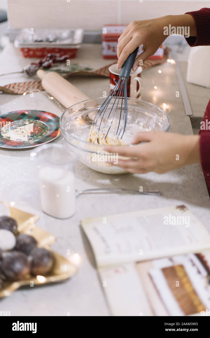 Close-up view of womans hands mixing cookies dough Stock Photo - Alamy