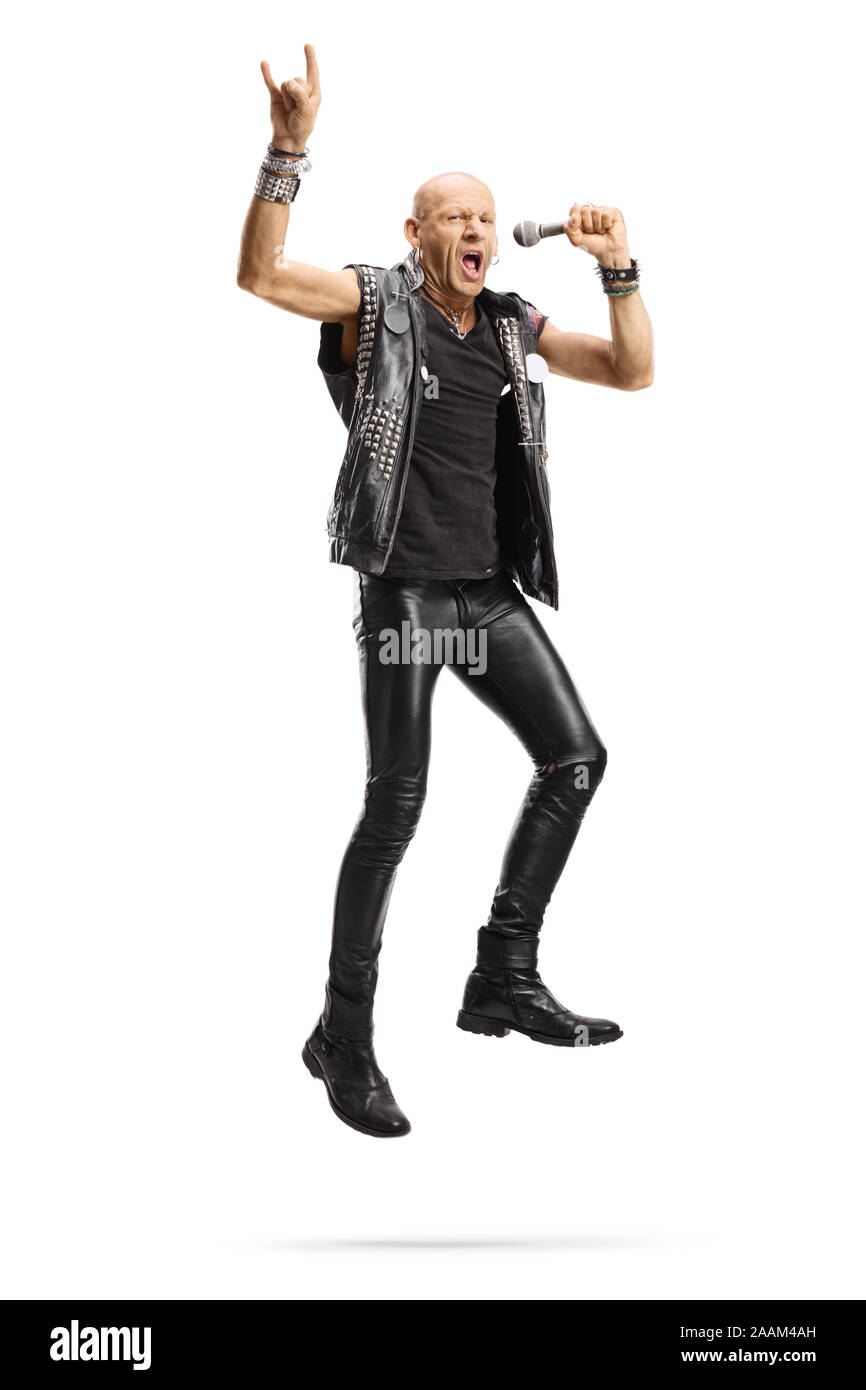 Full length portrait of a rock singer with a microphone gesturing a ...