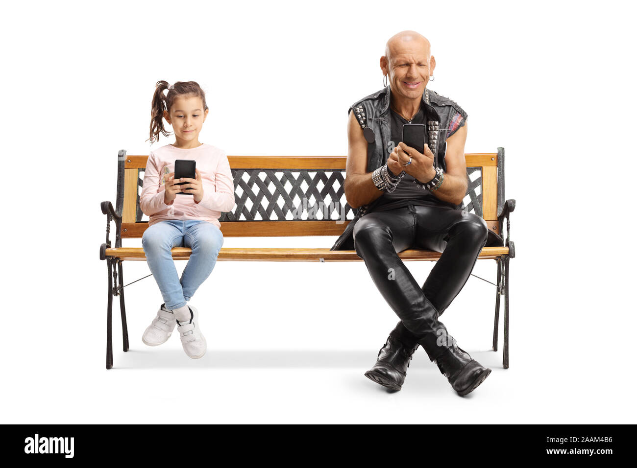 Little girl and a punk using mobile phones and sitting on a bench ...