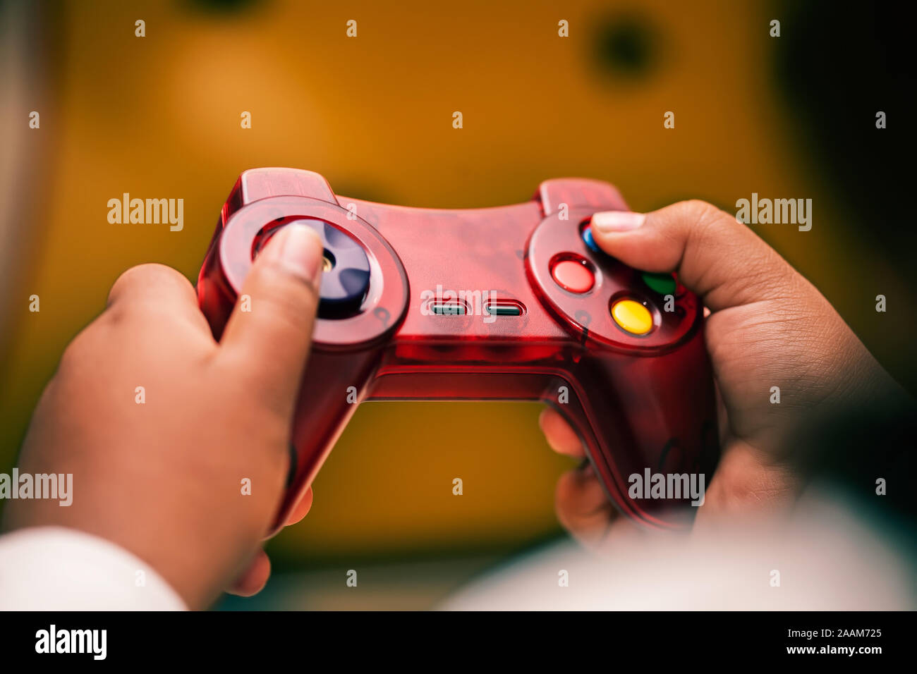 A little kids hands interacting and using a game pad to play scary ...