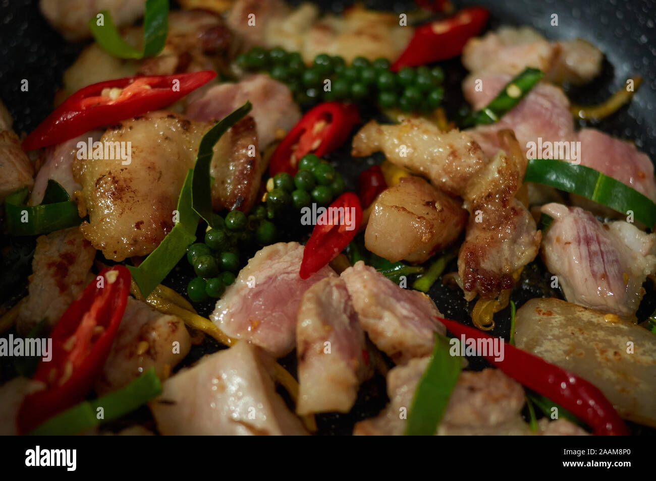 The ingredients stir-frying in the cooking pan Stock Photo - Alamy