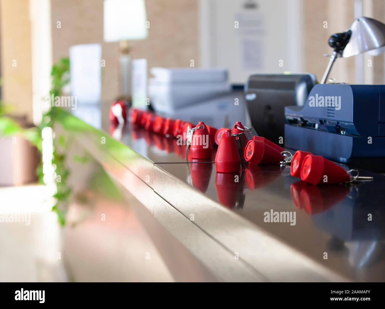 The Reception - Hotel key lying on the desk Stock Photo - Alamy