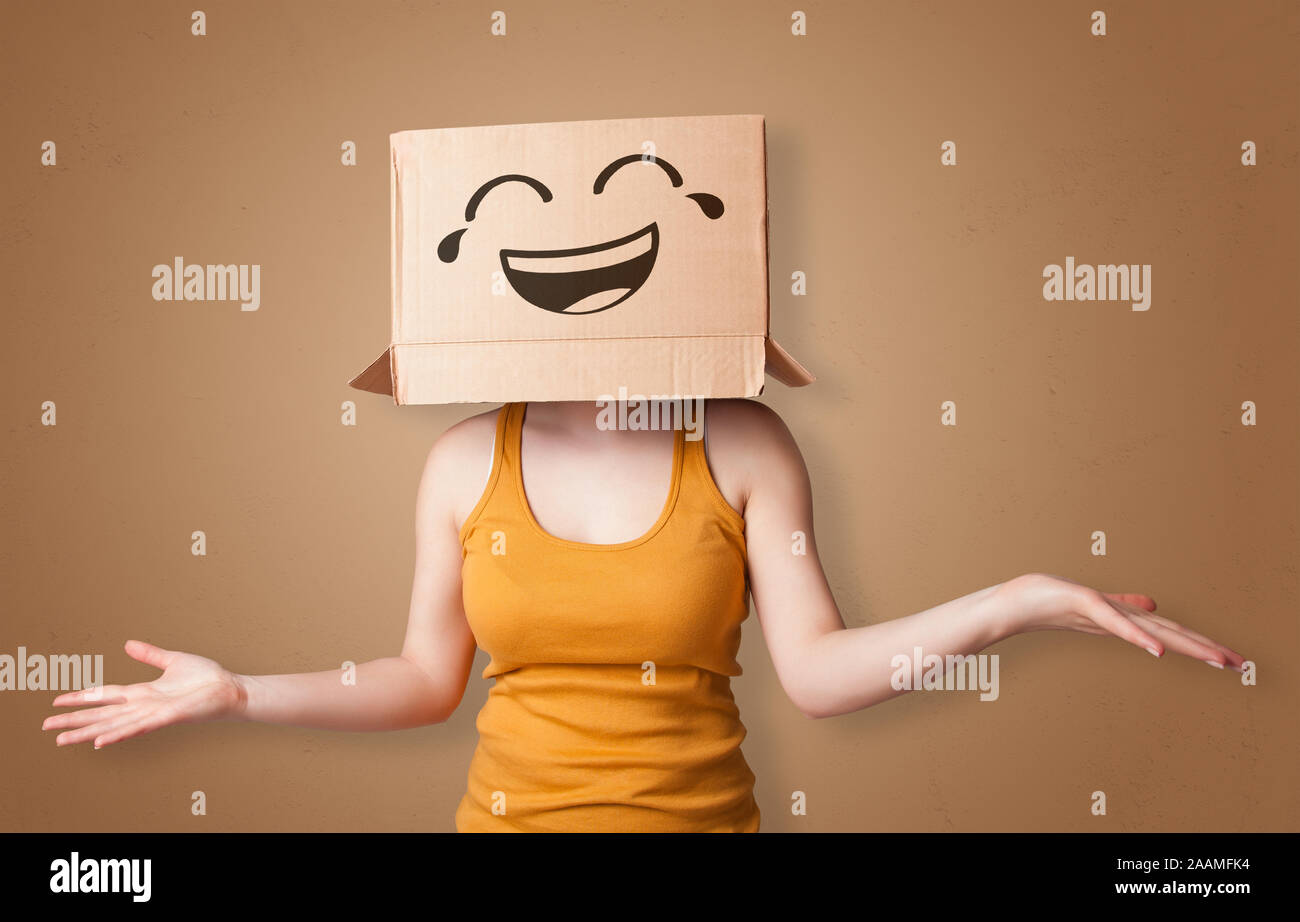 Funny woman wearing cardboard box on her head with smiley face Stock ...
