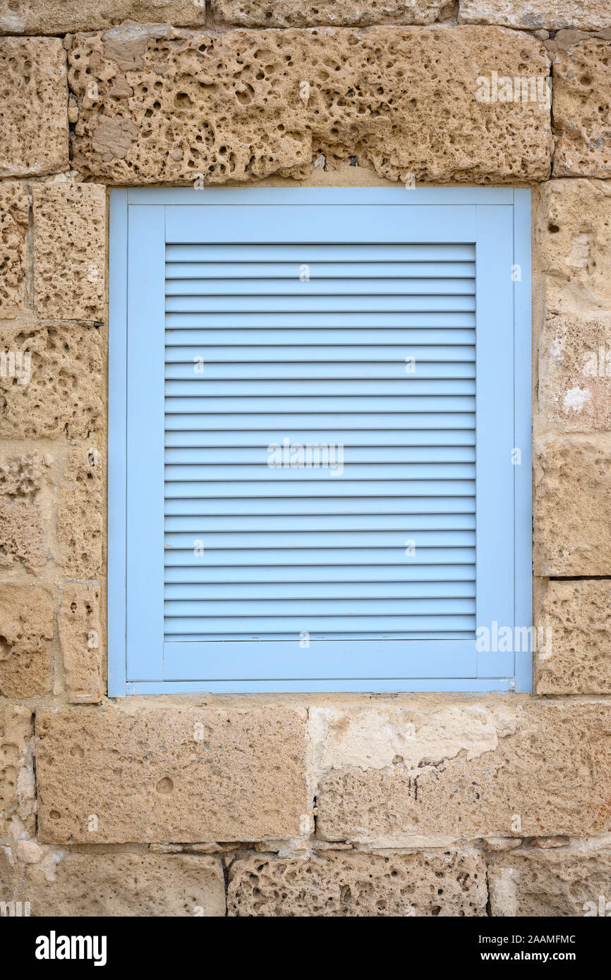 Close up of a Brick wall with window. Granite textured wall from the ...