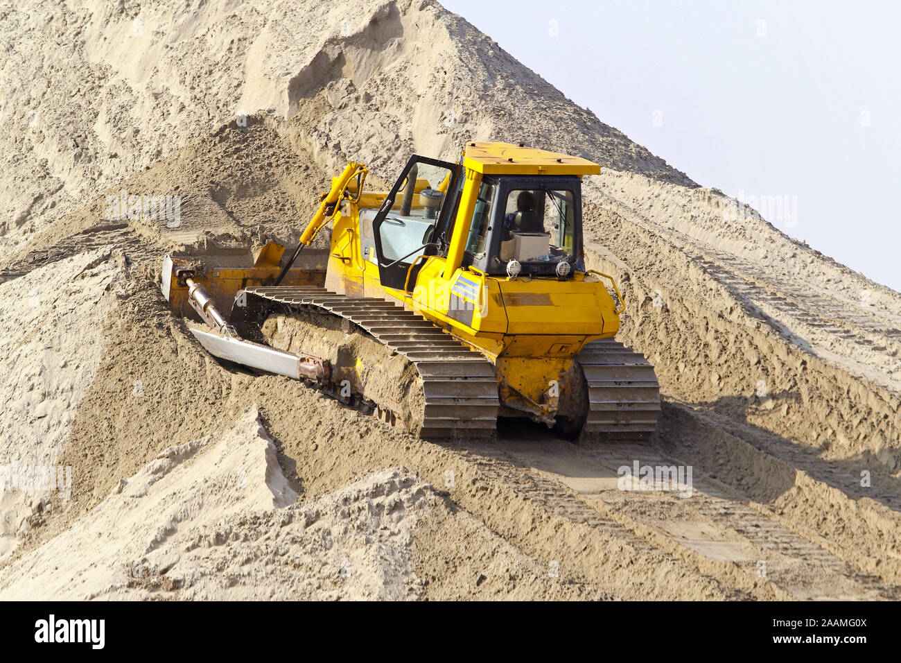 Bulldozer with track move sand at construction site Stock Photo - Alamy