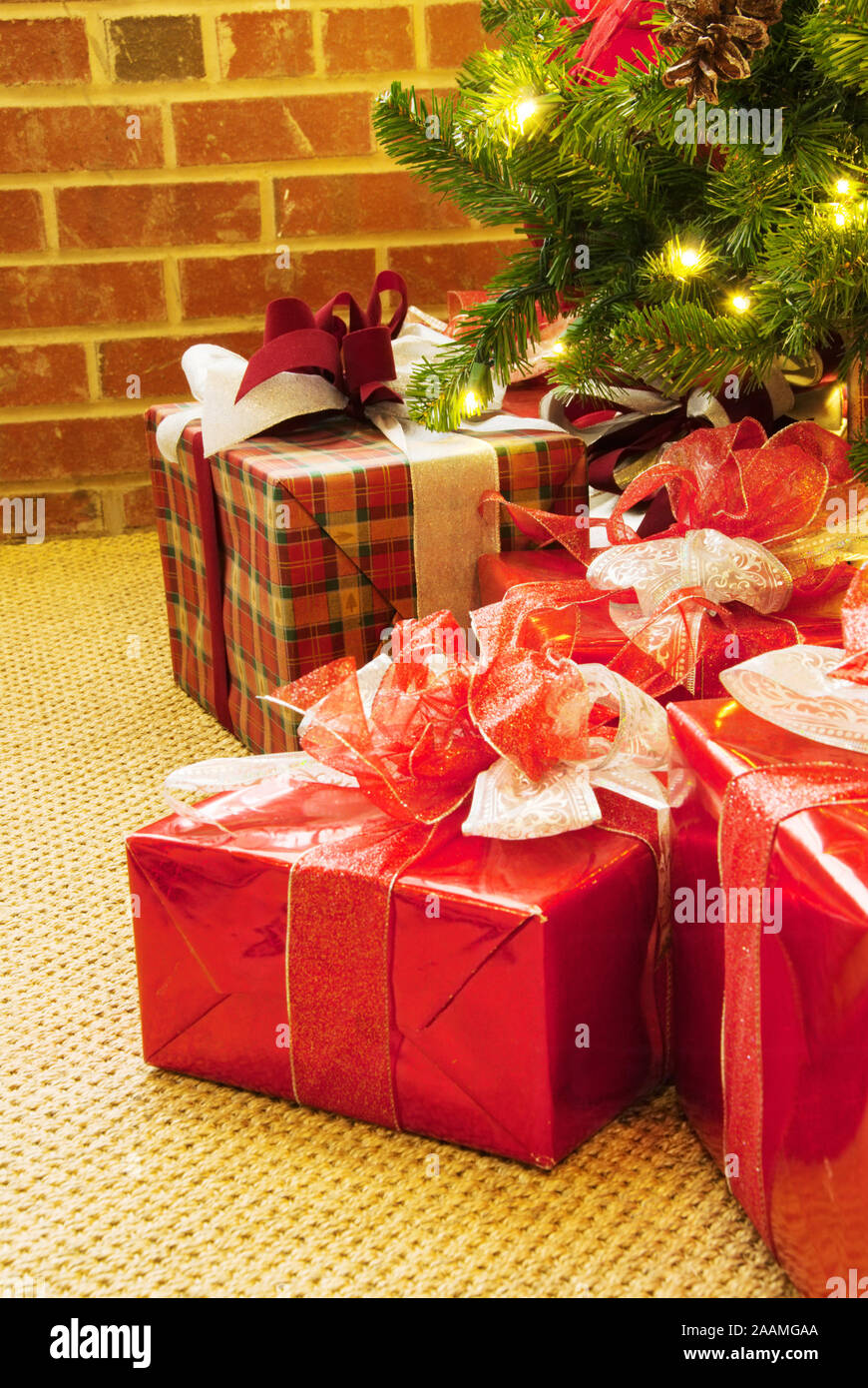 Large wrapped presents with decorative shiny bows and ribbons ...