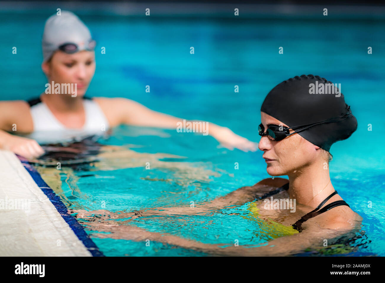 Women in indoor swimming pool Stock Photo - Alamy