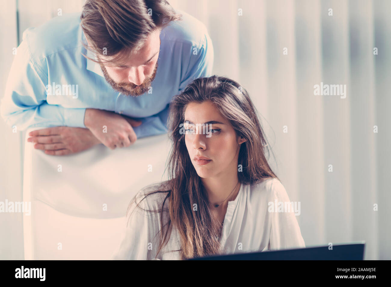 Pressure at work. boss pressures new female worker Stock Photo - Alamy