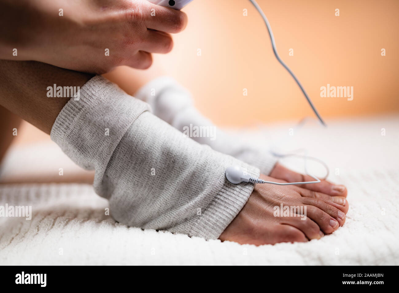 Physical therapy with TENS machine Stock Photo - Alamy