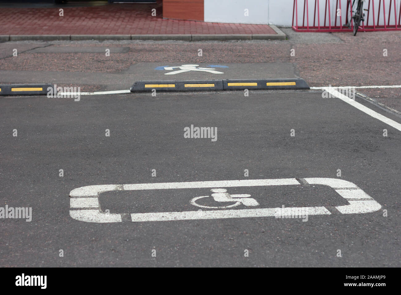 sign disabled person and man separately on the pavement. transport ...