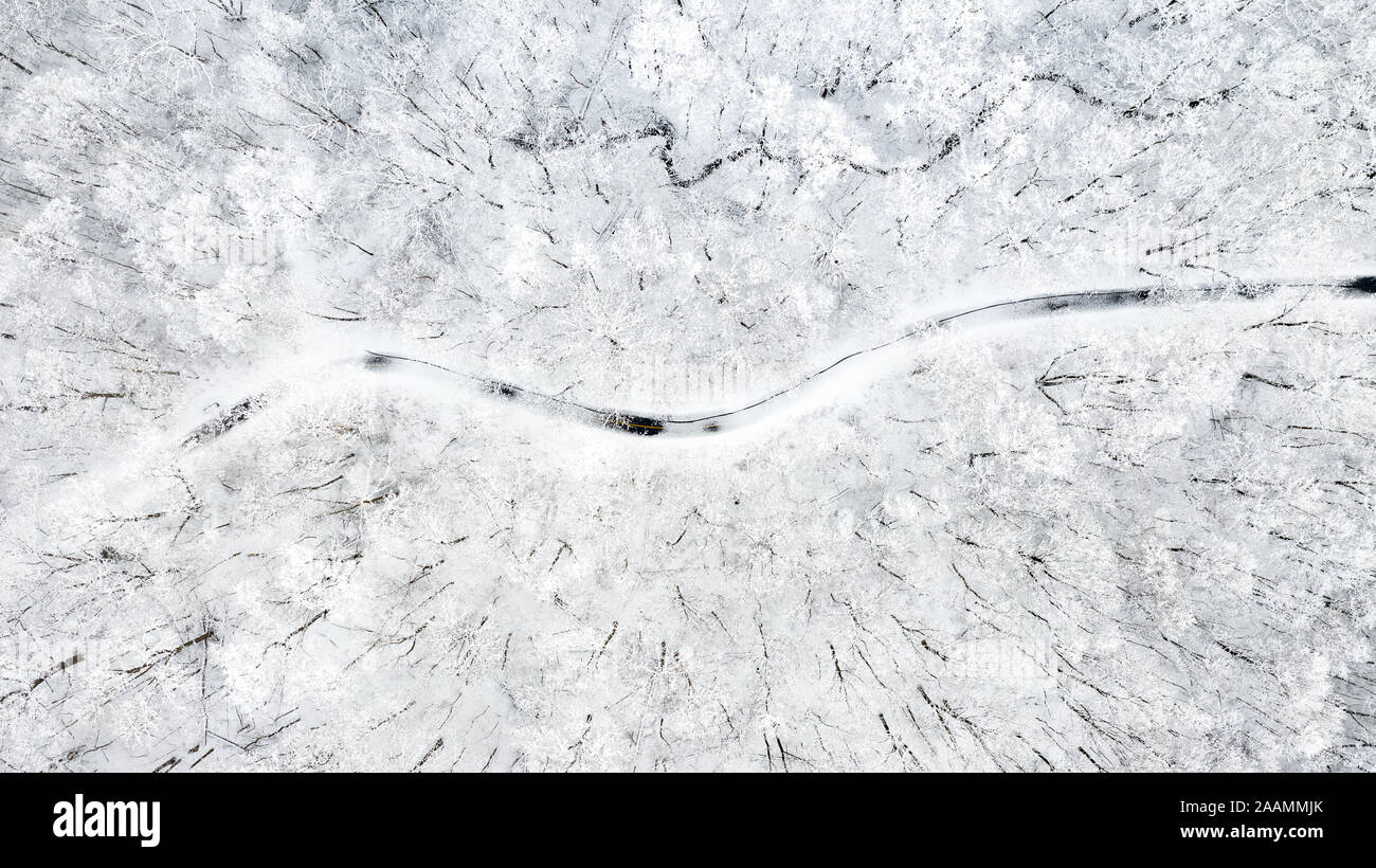 A drone / aerial view of a path covered with snow and ice Stock Photo ...