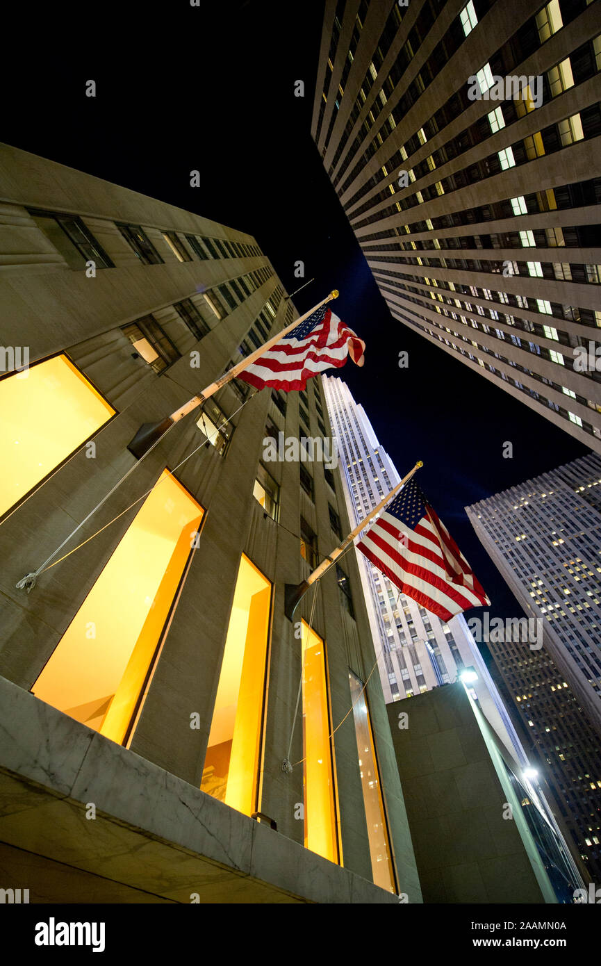 American flags waving on skyscraper at Rockefeller Center in New York ...