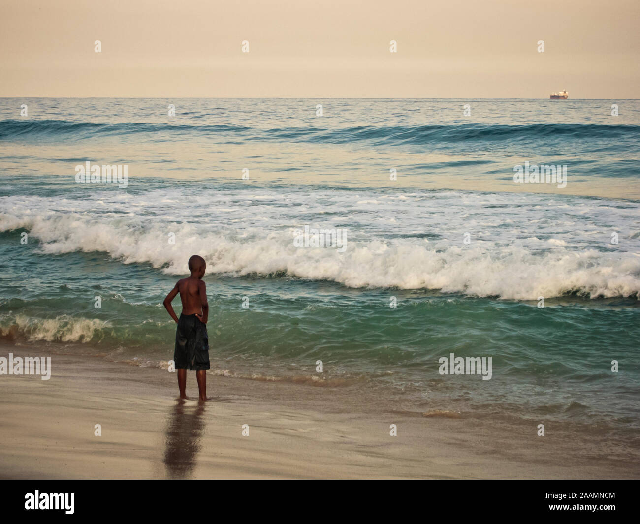 Stormy beach boy hi-res stock photography and images - Alamy