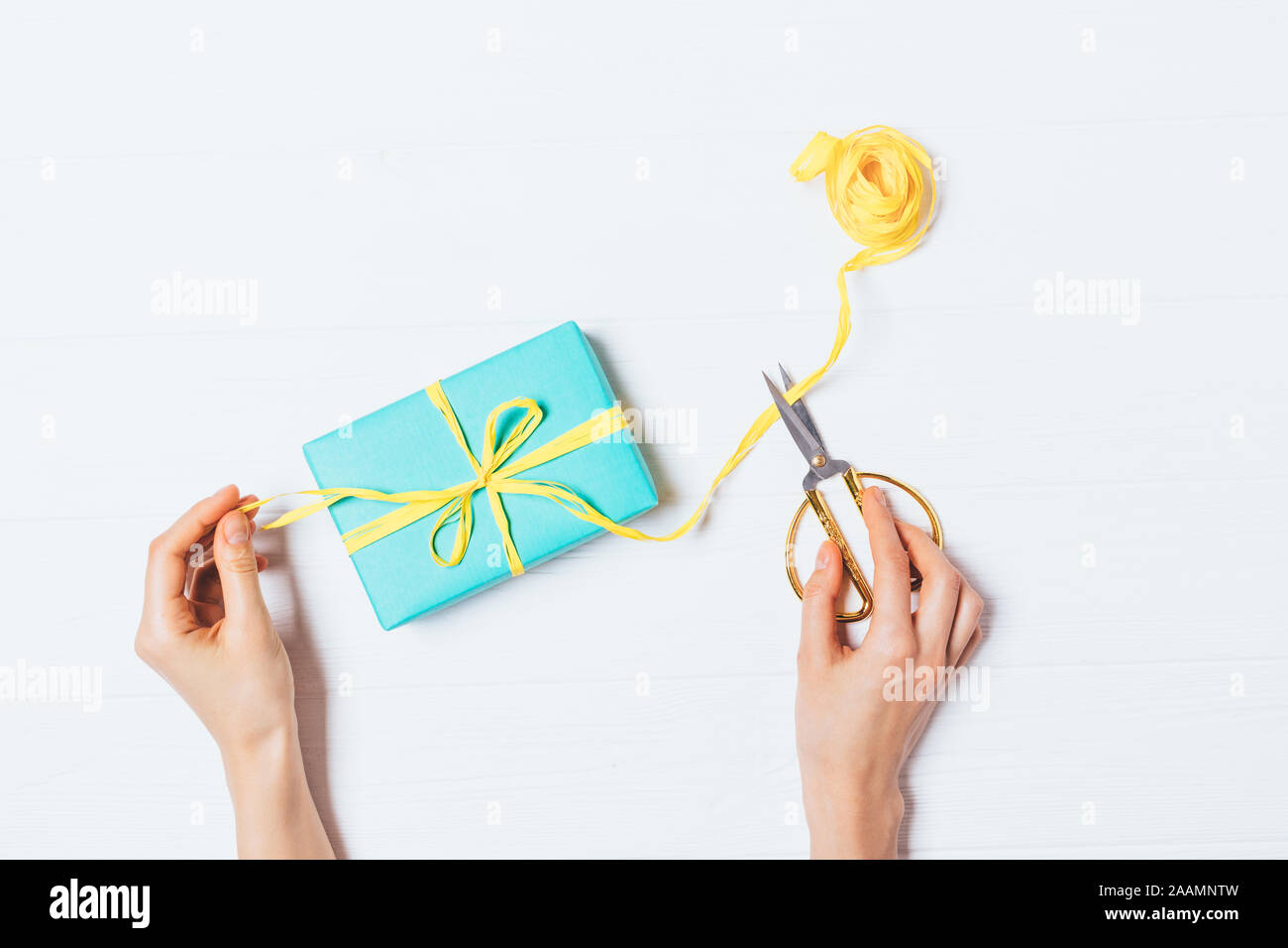 Girl wrapping hands yellow hi-res stock photography and images - Alamy