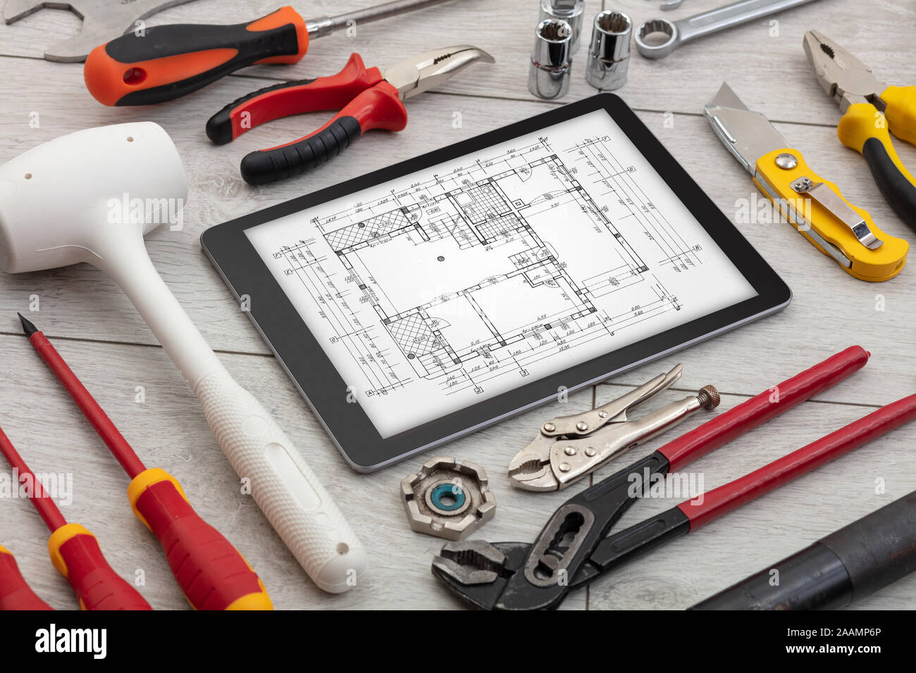 Tablet with construction tools and blueprint concept Stock Photo - Alamy
