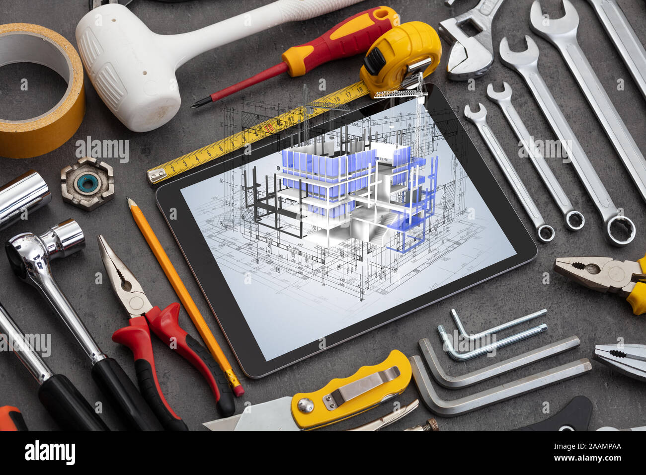 Tablet with construction tools and 3d house plan concept Stock Photo ...