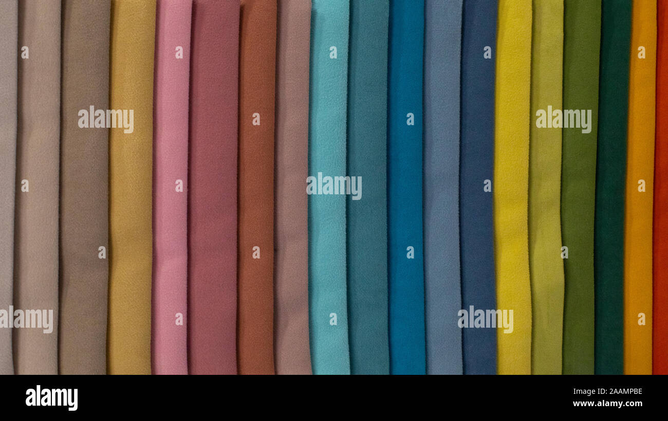 Multi-colored strips of fabric, samples of textile material. Soft ...