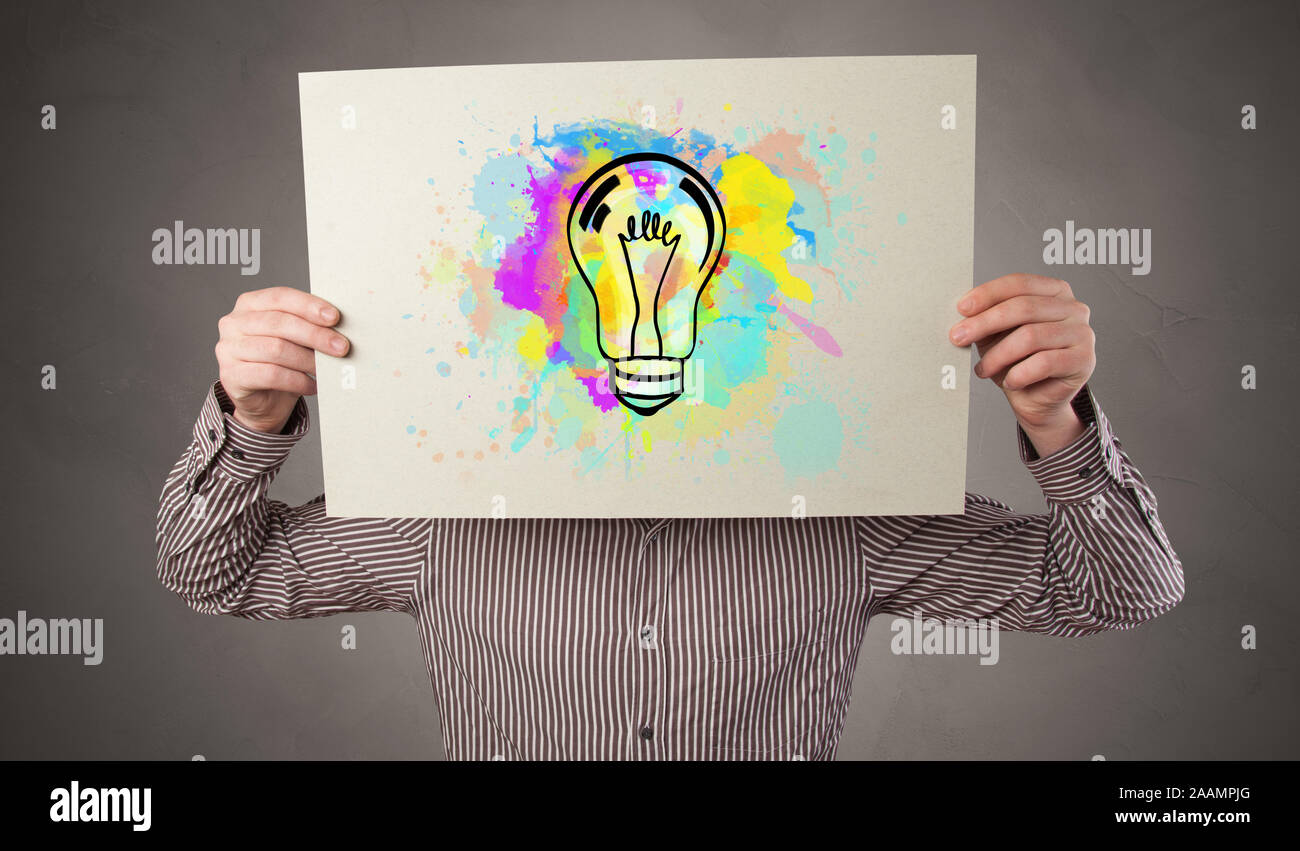 Person holding a paper with a drawn colorful idea concept Stock Photo ...