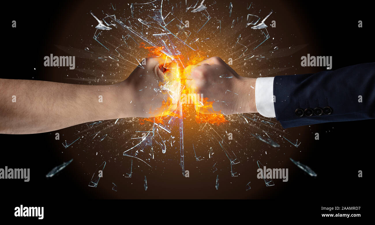 Two hands fighting and breaking a glass into small pieces Stock Photo ...