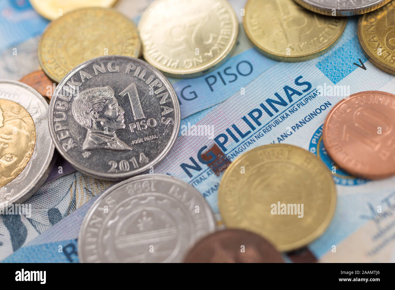Cash Banknote Of One Thousand Philippines Peso And Coins Paying Bills cash-banknote-of-one-thousand-philippines-peso-and-coins-paying-bills