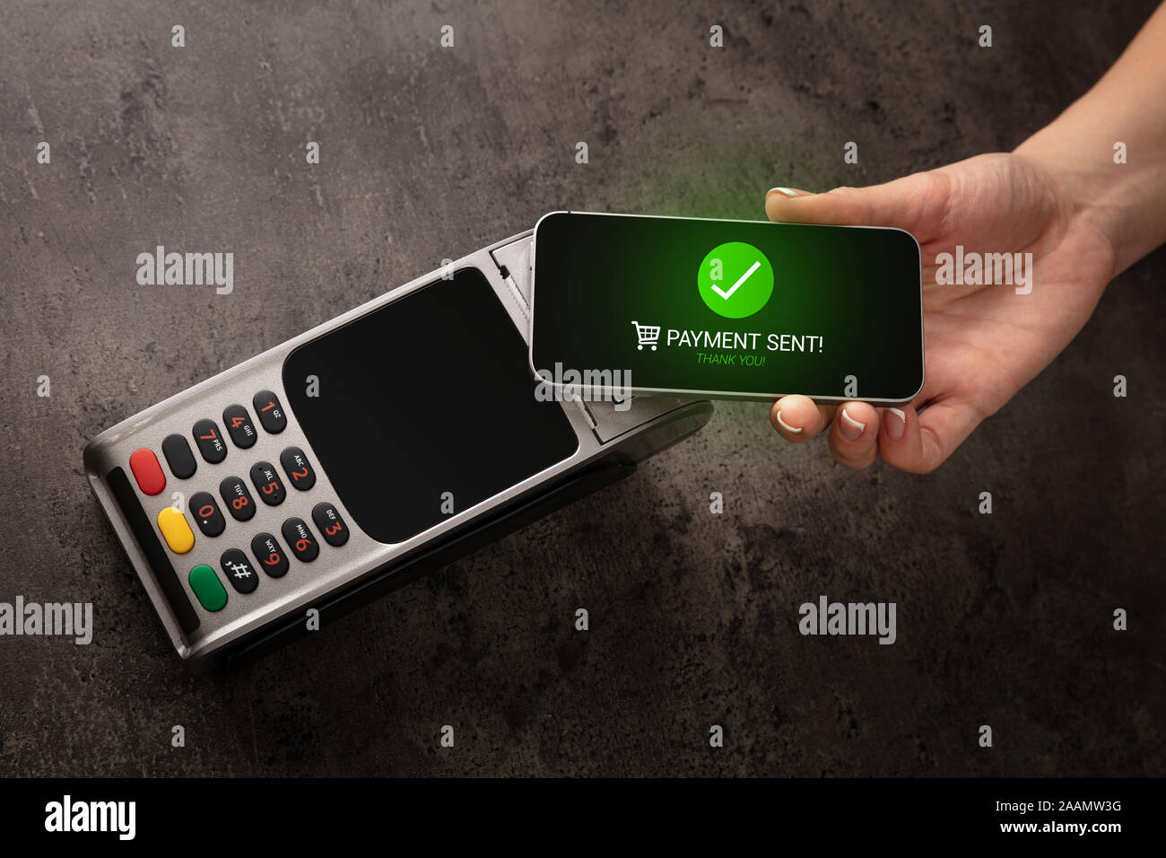 Mobile payment accepted on terminal Stock Photo - Alamy
