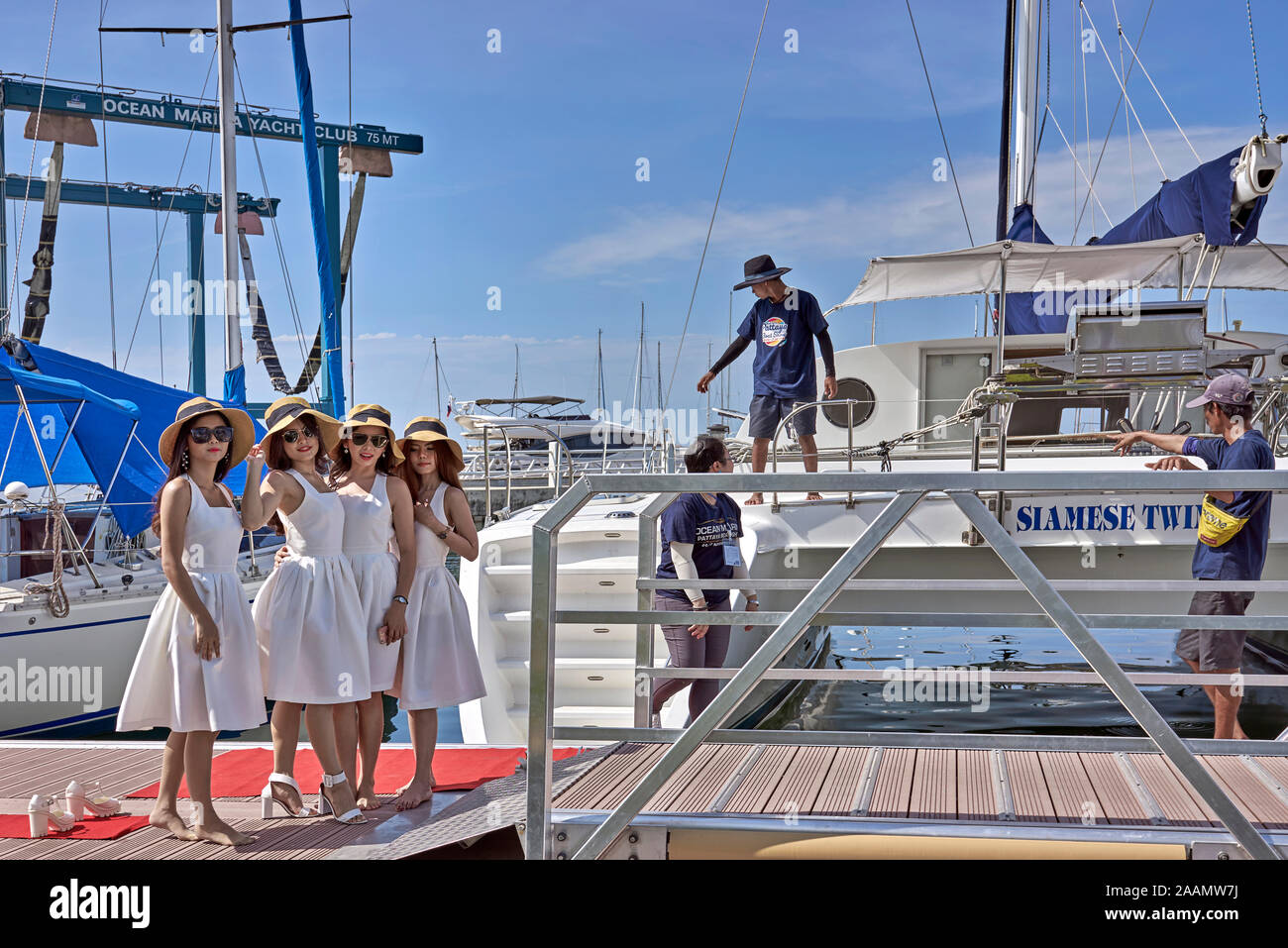 Promotion girls. Models posing on a luxury yacht at the Pattaya boat ...
