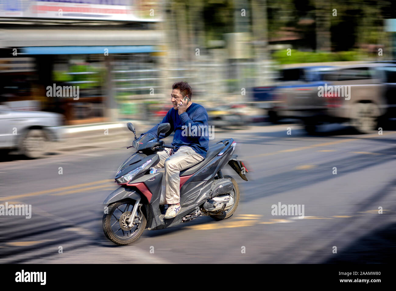 Motorcycle speeding road blurred motion Motorbike rider speeding along ...