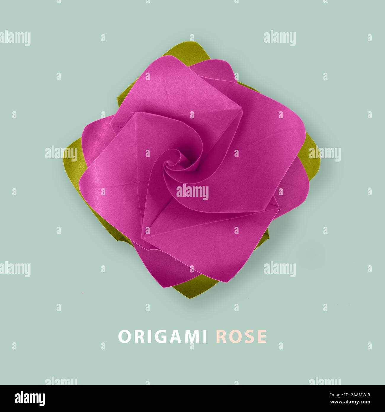 Pink purple paper origami handmade rose on blue Stock Photo - Alamy