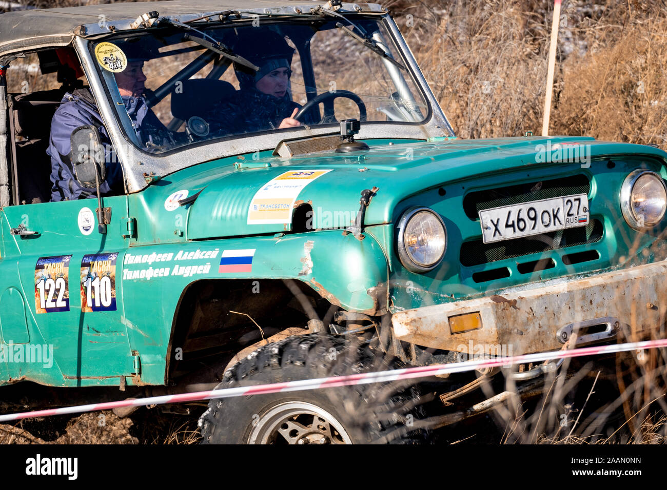 Jeep UAZ overcomes obstacles in the forest Stock Photo - Alamy
