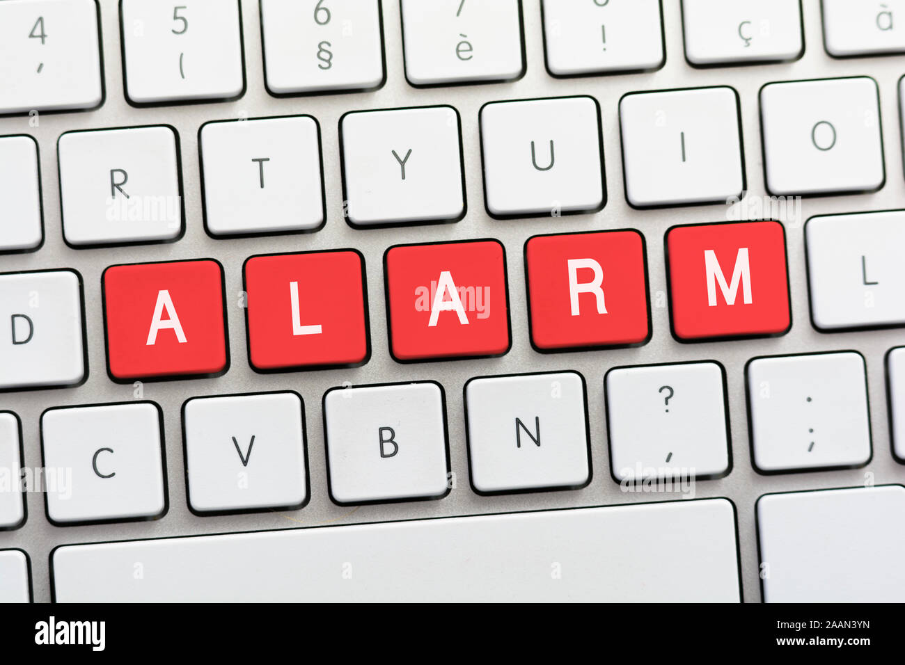 ALARM writing on white keyboard Stock Photo - Alamy