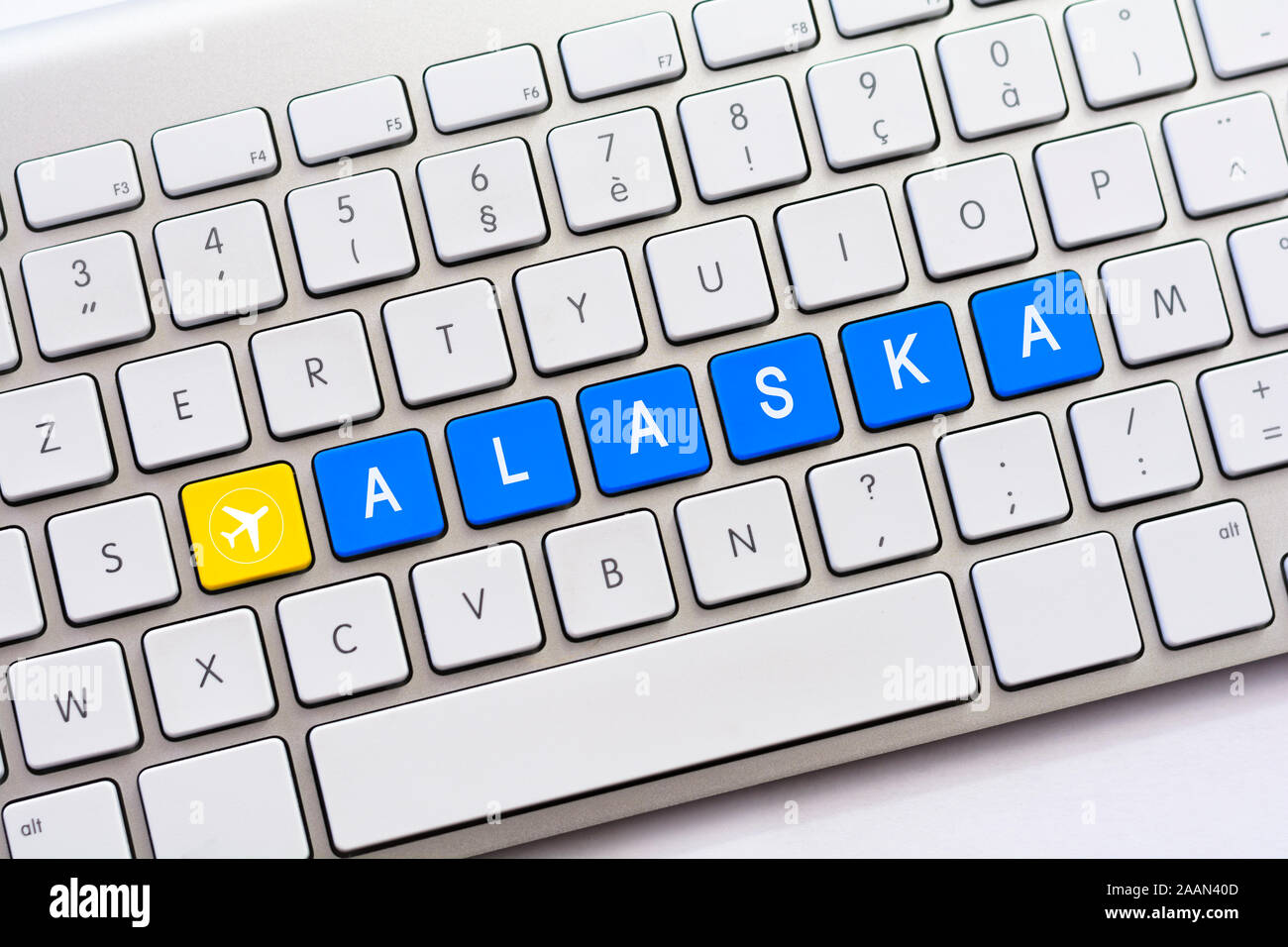 ALASKA writing on white keyboard with a aircraft sketch Stock Photo - Alamy